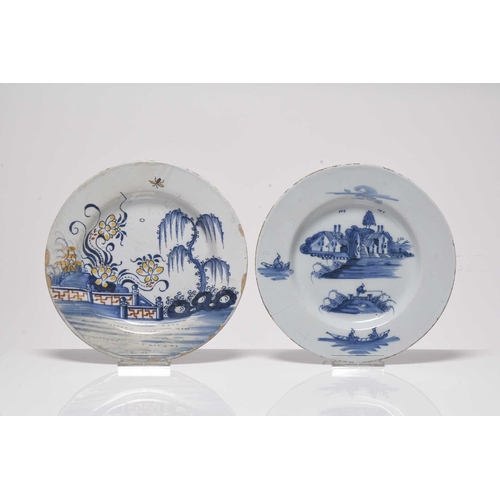 A Liverpool delft plate, circa 1760, painted in blue with two houses in ...