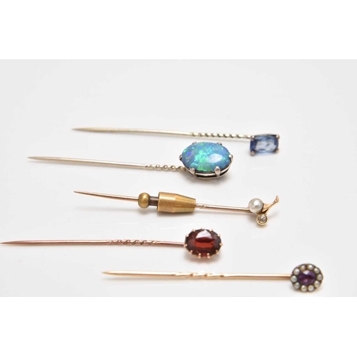 A collection of stone set stick pins, comprising; a diamond and seed ...