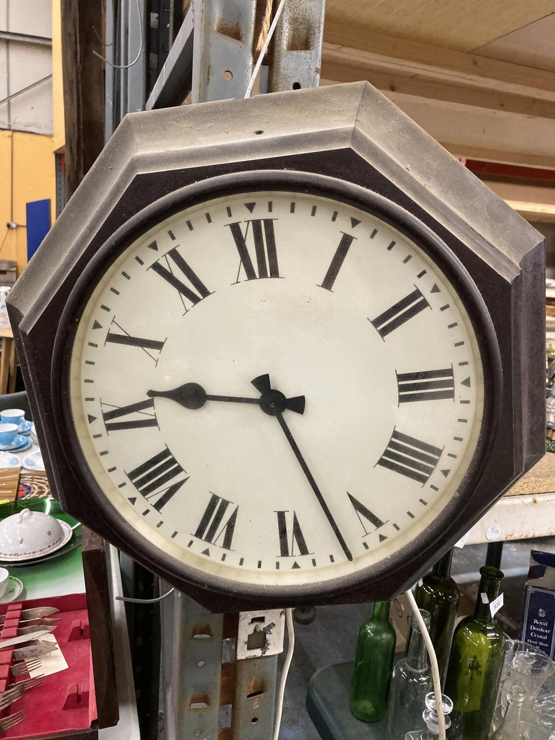 A LARGE BAKELITE ROMAN NUMERAL HEXAGON SHAPED WALL CLOCK