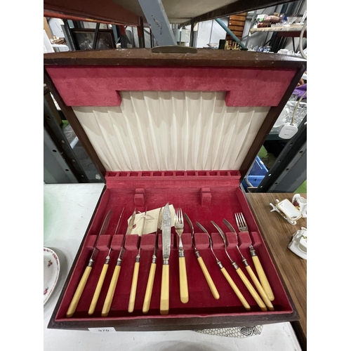 A CASED WOODEN CUTLERY BOX ALONG WITH A STERLING SILVER COLLARED KINFE ...