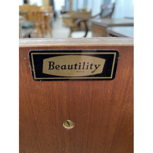 A RETRO TEAK 'BEAUTILITY' SIDEBOARD WITH THREE DRAWERS AND TWO ...