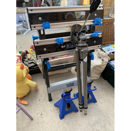 A MACALLISTER FOLDING WORK BENCH, A TRIPOD STAND AND TWO AXEL STANDS ETC