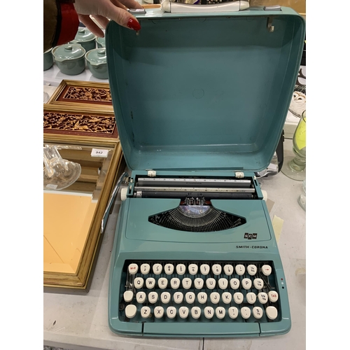 A VINTAGE SMITH-CORONA TYPEWRITER PLUS A SHARP PA-3140 ELECTRIC TYPEWRITER
