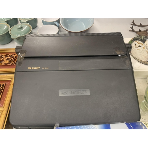 A VINTAGE SMITH-CORONA TYPEWRITER PLUS A SHARP PA-3140 ELECTRIC TYPEWRITER