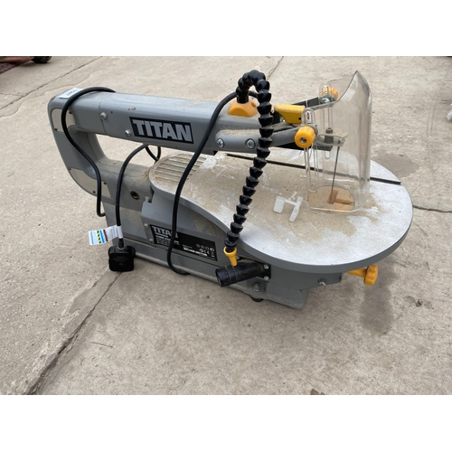 A TITAN TTB703SCW SCROLL SAW BELIEVED IN WORKING ORDER BUT NO WARRANTY