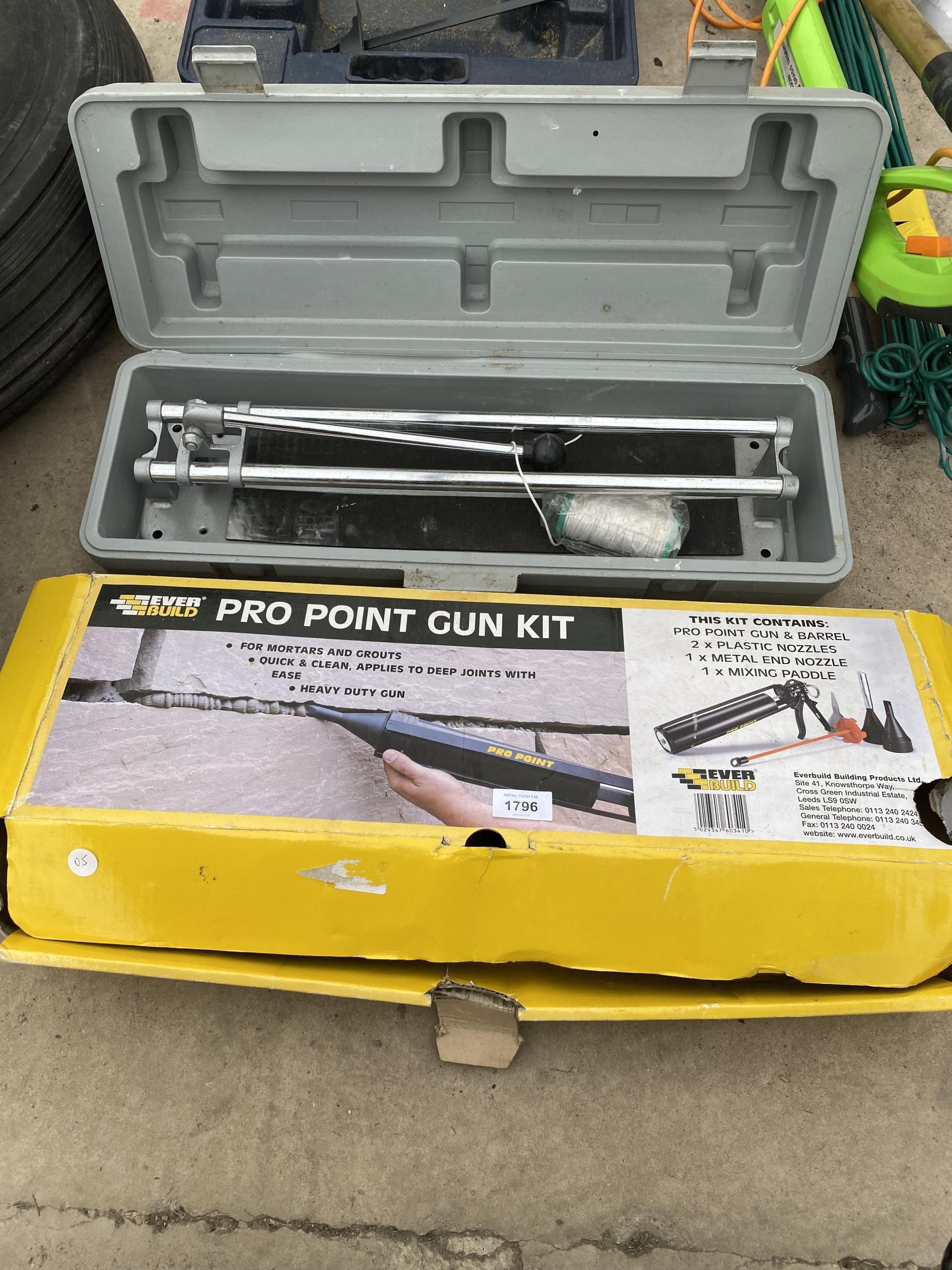 A PRO POINT GUN KIT AND A TILE CUTTER