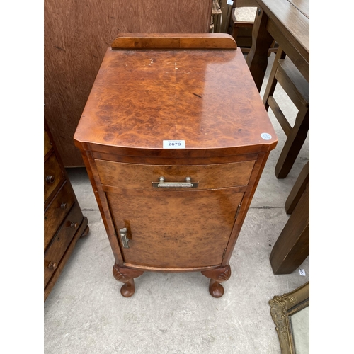 A WALNUT BEDSIDE CABINET ON CABRIOLE SUPPORTS WITH ONE DOOR AND ONE DRAWER
