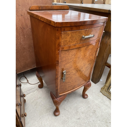 A WALNUT BEDSIDE CABINET ON CABRIOLE SUPPORTS WITH ONE DOOR AND ONE DRAWER