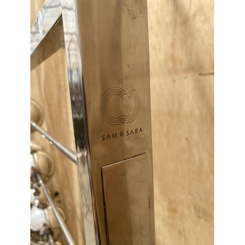 A LARGE STAINLESS STEEL ABACUS BY SAM AND SARA