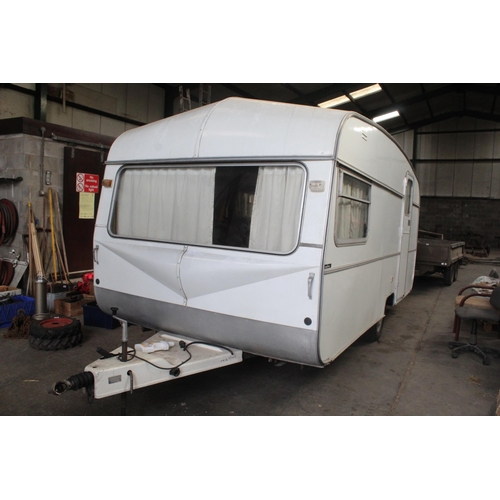 A THREE BERTH ACE COURIER SINGLE AXLE CARAVAN WITH A GOOD FRONT AWNING