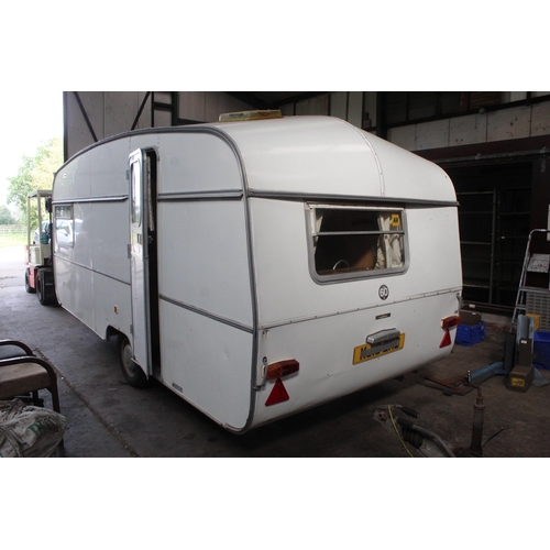 A THREE BERTH ACE COURIER SINGLE AXLE CARAVAN WITH A GOOD FRONT AWNING