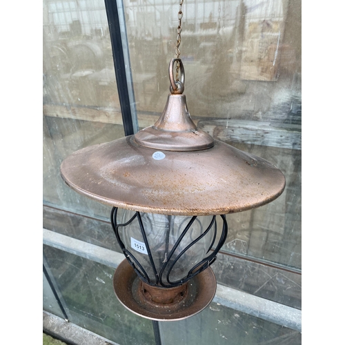 A DECORATIVE COPPER EFFECT LIGHT FITTING