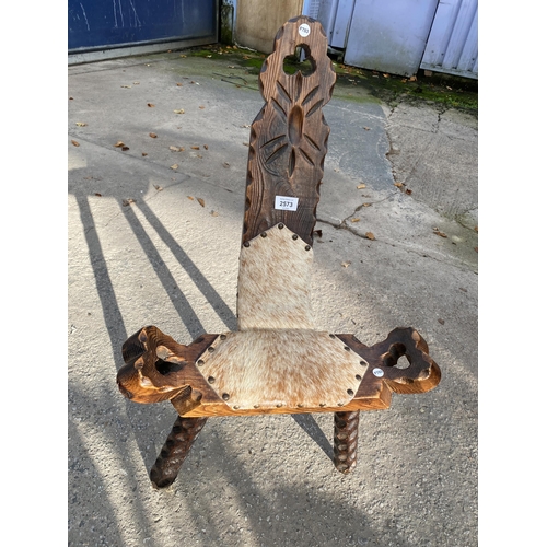 A CARVED SPANISH STYLE SPINNING STOOL