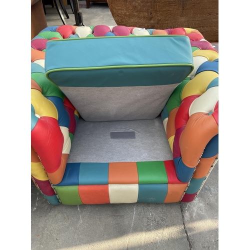 A MODERN CHESTERFIELD STYLE BOLD MULTI COLOURED EASY CHAIR