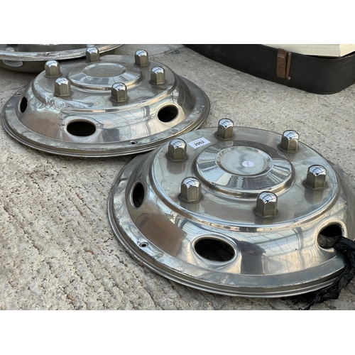 A SET OF FOUR METAL HUB CAPS