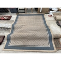 A MODERN BLUE HESSIAN RUG