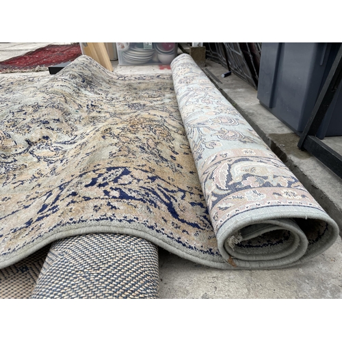 A MEDIUM SIZED GREEN PATTERNED FRINGED RUG