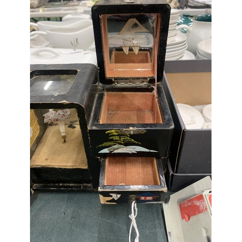 AN ORIENTAL DESIGN JEWELLERY BOX WITH BALLERINA DANCER MECHANISM