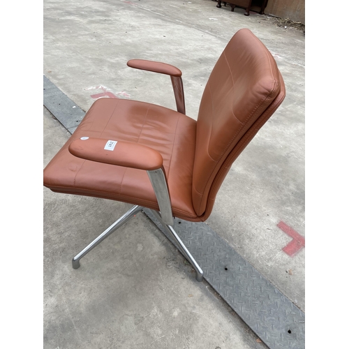 A BOSS DESIGN GROUP LEATHER SWIVEL CHAIR ON POLISHED ALLOY BASE