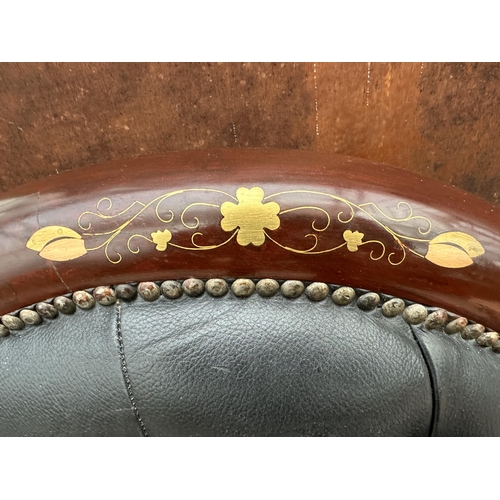 A BRASS INLAID INDIAN HARDWOOD AND BUTTONED LEATHER SCROLL END ...