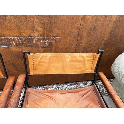A PAIR OF WROUGHT IRON CAMPAIGN STYLE CHAIRS ON X FRAMES WITH LEATHER ...