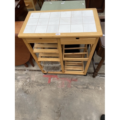 A MODERN KITCHEN WORK TABLE ON CASTORS WITH TILED TOP