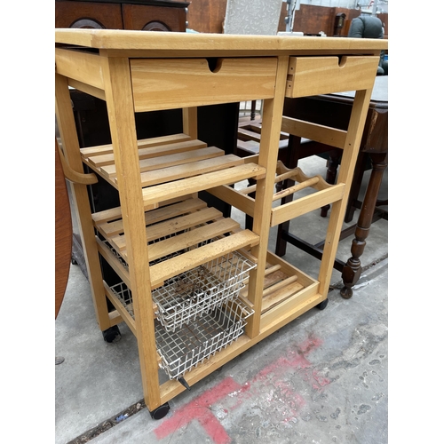 A MODERN KITCHEN WORK TABLE ON CASTORS WITH TILED TOP