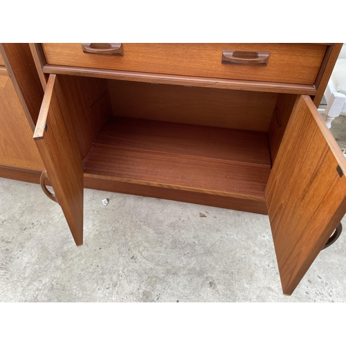 A RETRO TEAK G-PLAN UNIT ENCASING DRAWER AND CUPBOARD 33" WIDE