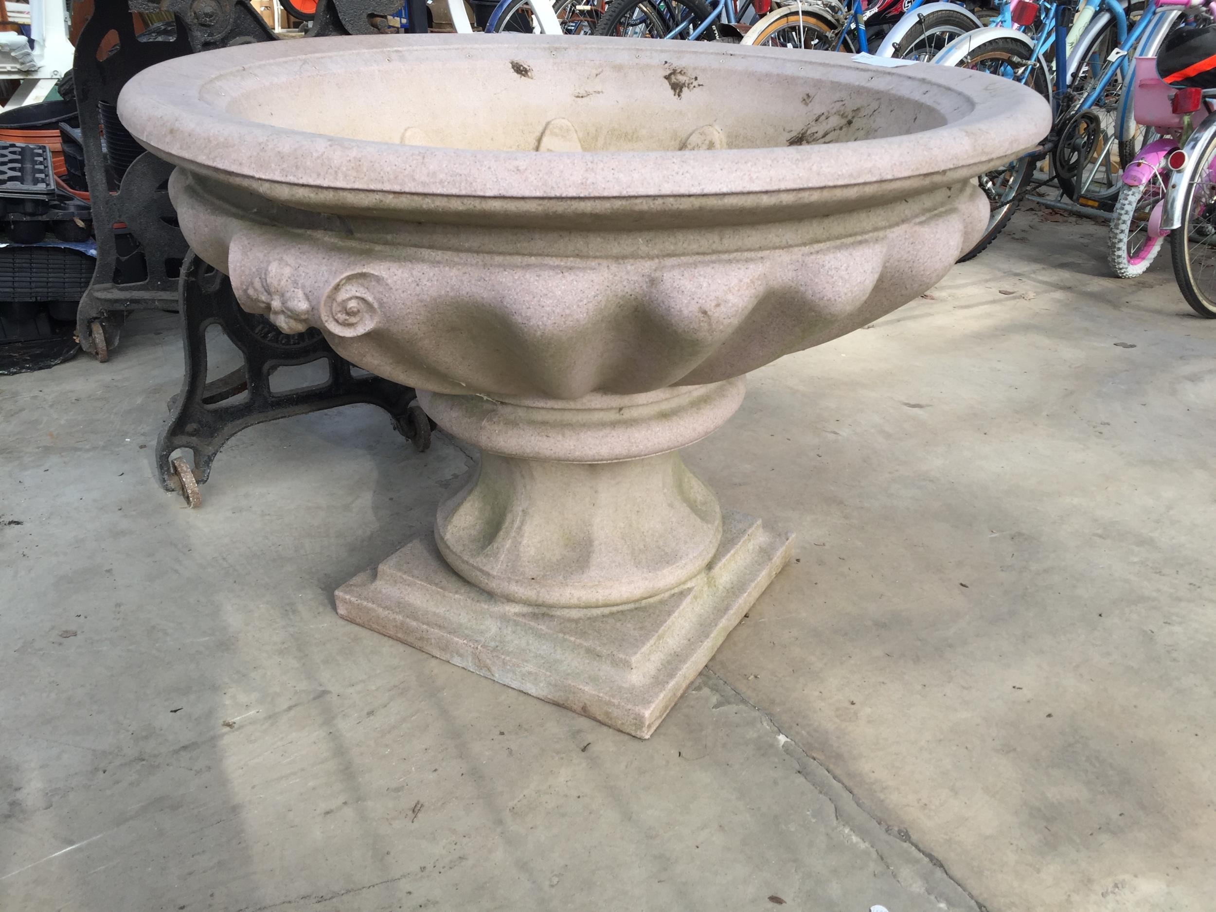 A LARGE PLASTIC WATER FEATURE