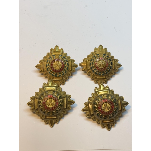 FOUR MILITARY METAL PIP BADGES