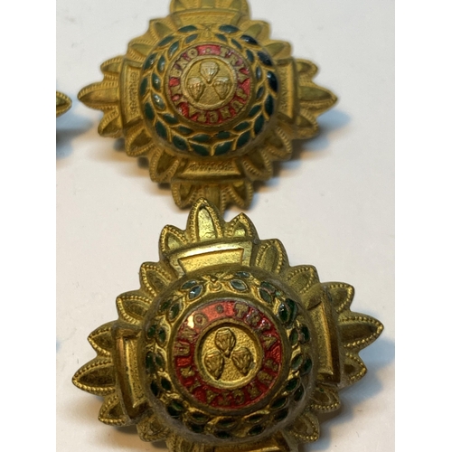 FOUR MILITARY METAL PIP BADGES