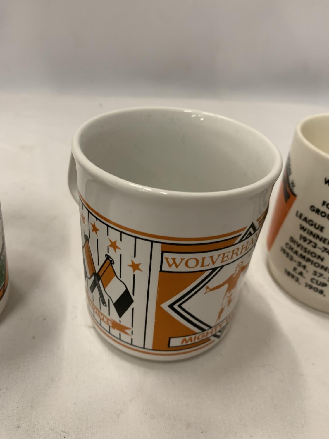 THREE WOLVERHAMPTON WANDERERS MUGS FROM THE 1960'S, 1970'S AND 1980'S