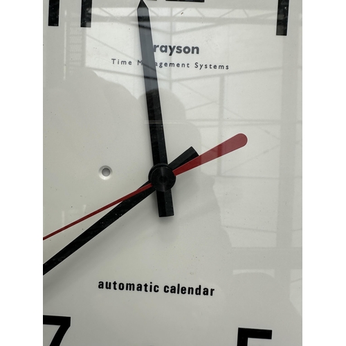 A RETRO AUTOMATIC CALANDER WALL CLOCK