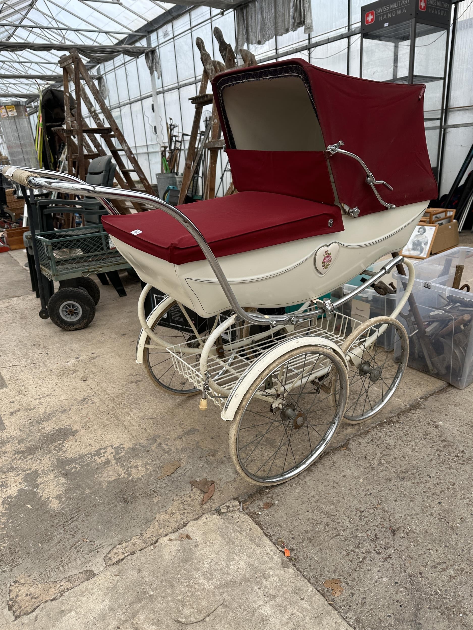 A VINTAGE SILVER CROSS PRAM