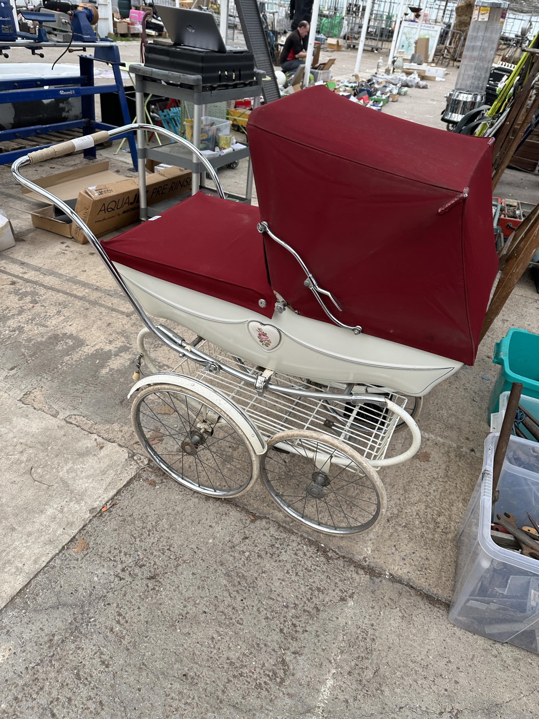 A VINTAGE SILVER CROSS PRAM