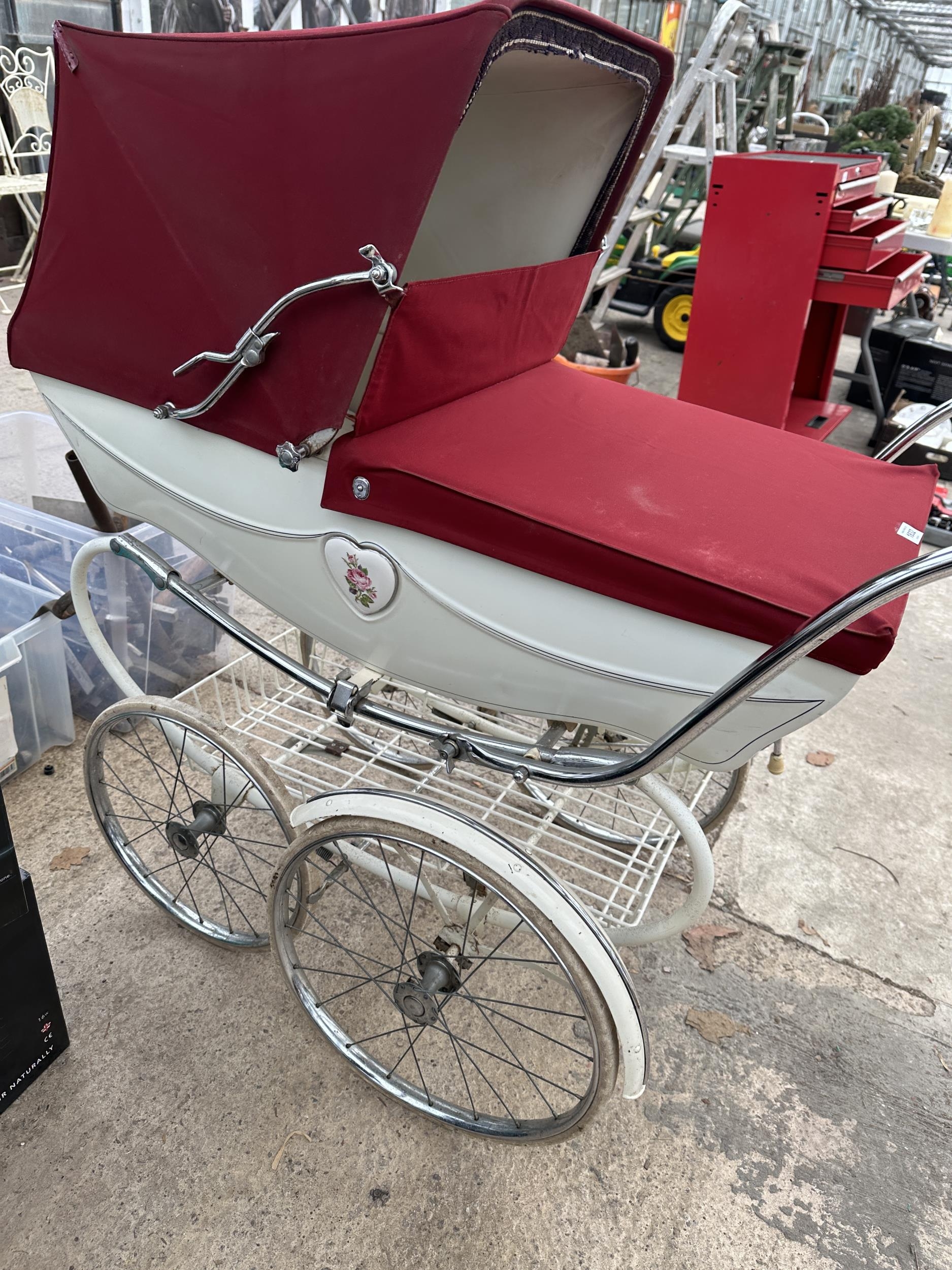 A VINTAGE SILVER CROSS PRAM