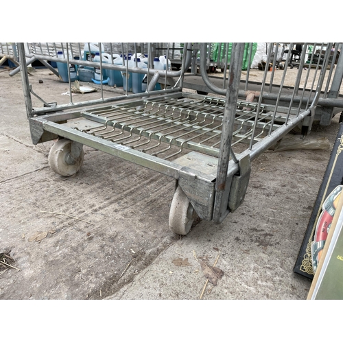 A LARGE METAL WAREHOUSE FOUR WHEELED CAGE