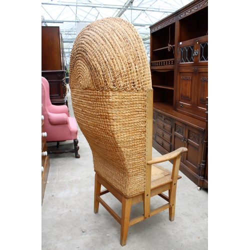 A HOODED OAK FRAMED ORKNEY CHAIR WITH WICKER SEAT AND STITCHED STRAW ...