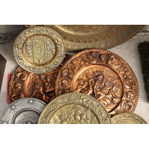 A LARGE ASSORTMENT OF VINTAGE BRASS AND COPPER WALL CHARGERS