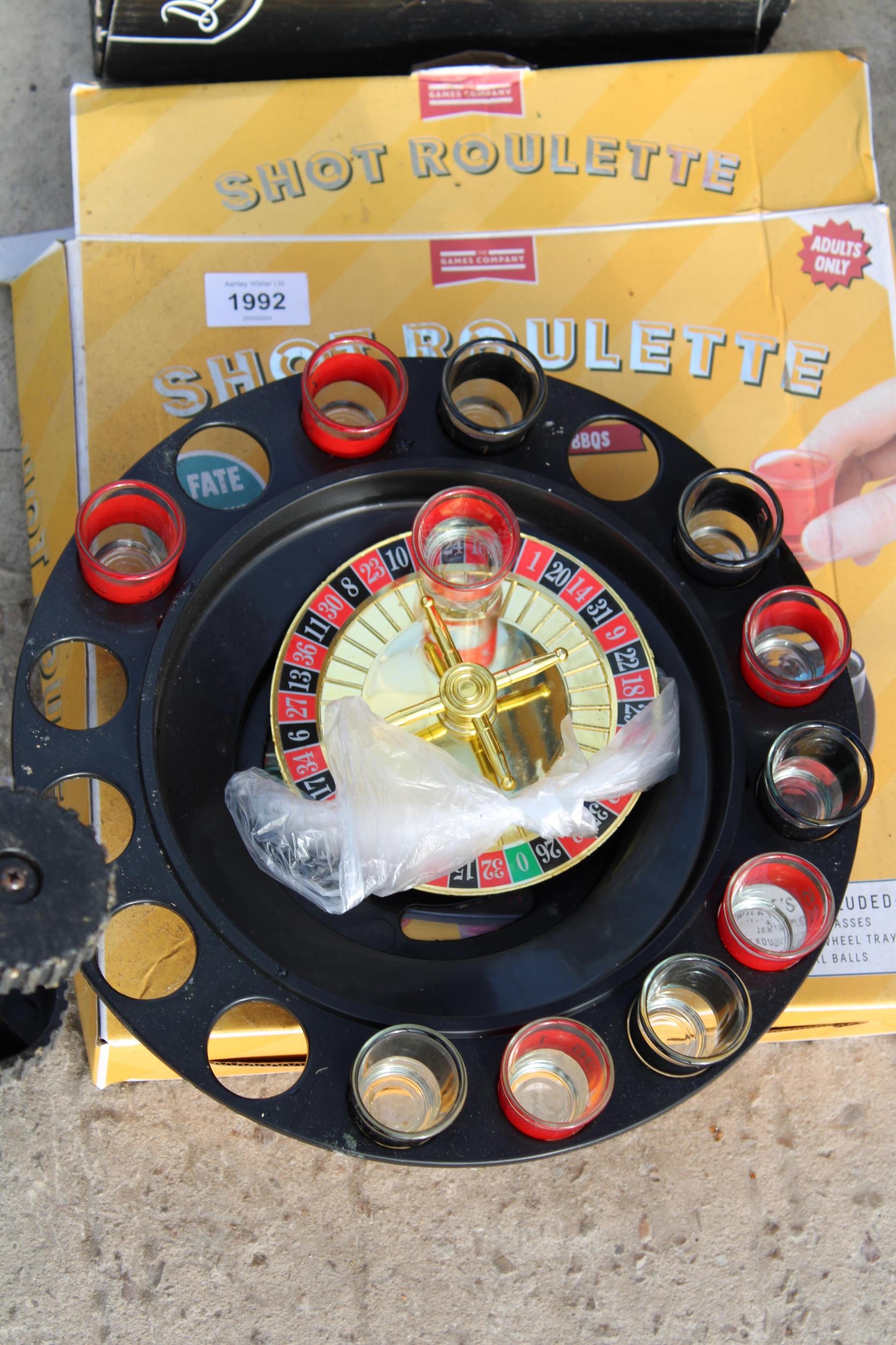 A SHOT ROULETTE GAME AND AN ASSORTMENT OF GLASS AND CERAMIC CANDLE ...