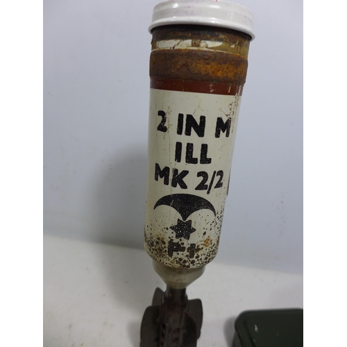 A 20TH CENTURY INERT MORTAR SHELL, A GUN CLEANING KIT AND AN ANTI GAS TIN