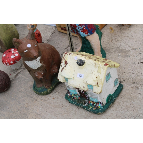 THREE CONCRETE GARDEN FIGURES TO INCLUDE A FOX AND A HOUSE ETC