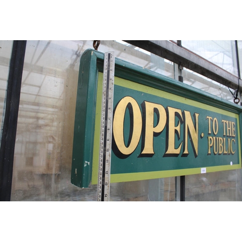 A HAND PAINTED 'OPEN TO THE PUBLIC' WOODEN SIGN