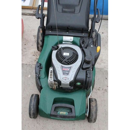AN ATCO PETROL LAWN MOWER WITH GRASS BOX AND BRIGGS AND STRATTON ENGINE
