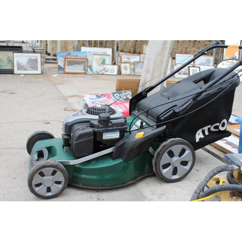 AN ATCO PETROL LAWN MOWER WITH GRASS BOX AND BRIGGS AND STRATTON ENGINE