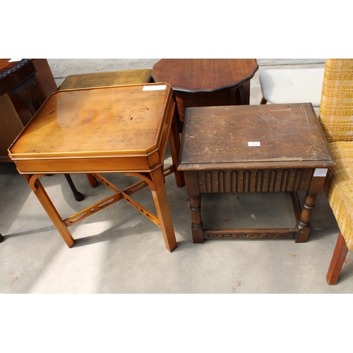 AN OAK JACOBEAN STYLE STOOL WITH DRAWER AND YEW WOOD LAMP TABLE