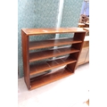 A FABRIC FOUR DIVISION SCREEN AND FOUR TIER OPEN BOOKCASE