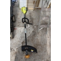 A RYOBI PETROL GRASS STRIMMER