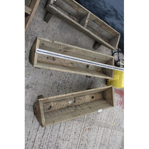 THREE RUSTIC WOODEN TROUGH PLANTERS