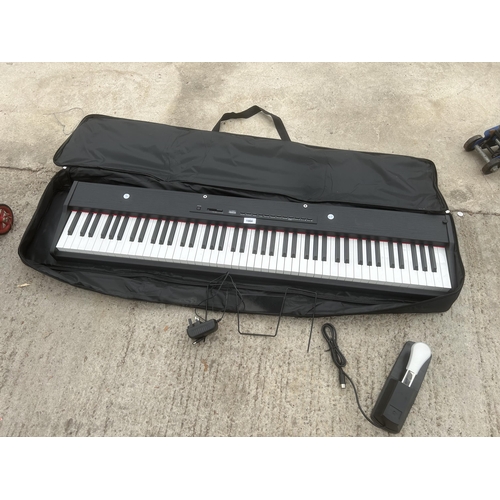 AN ELECTRIC PIANO KEYBOARD WITH CARRY BAG